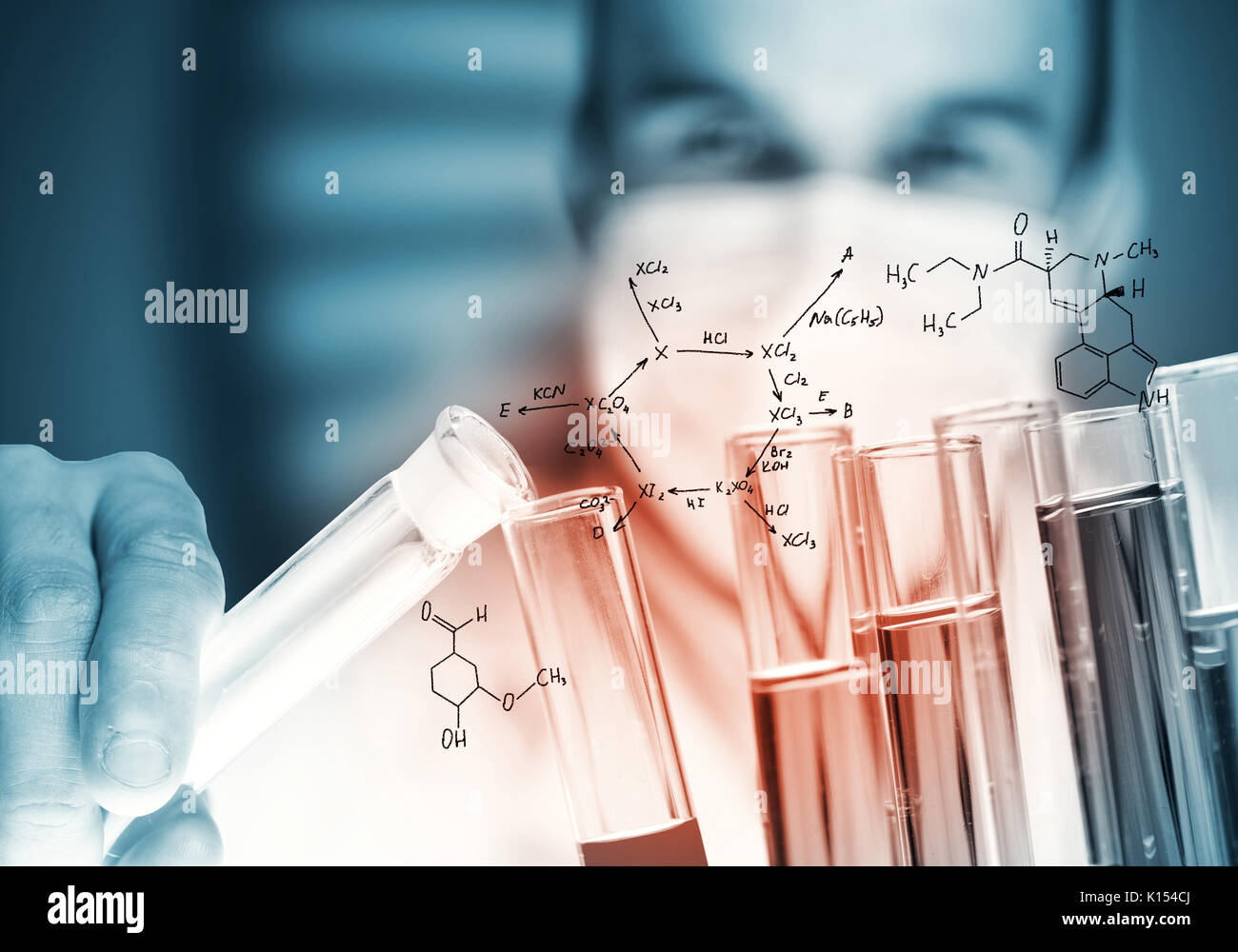 Portrait of concentrated male scientist working with reagents in ...