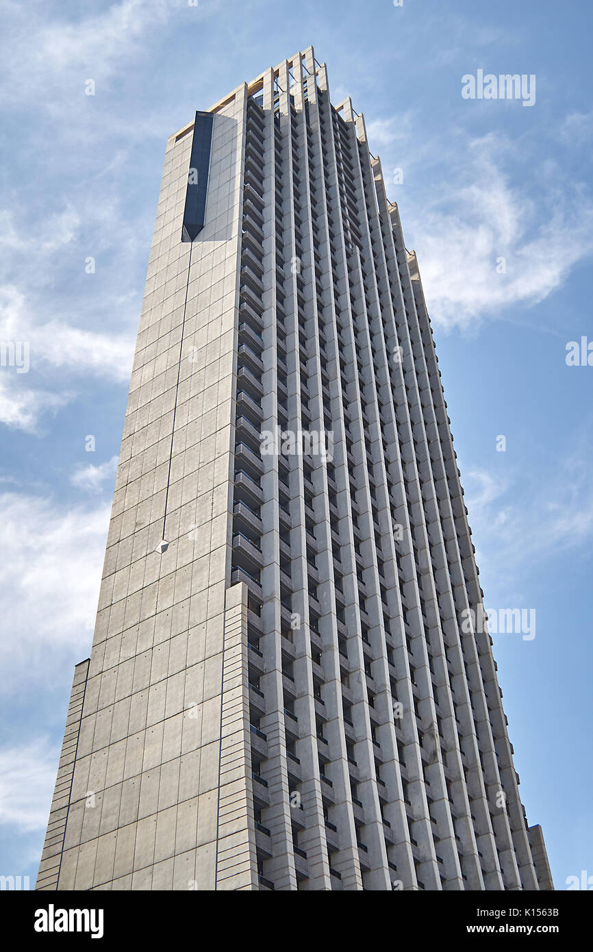 High building contrast with blue sky and white clouds Stock Photo - Alamy