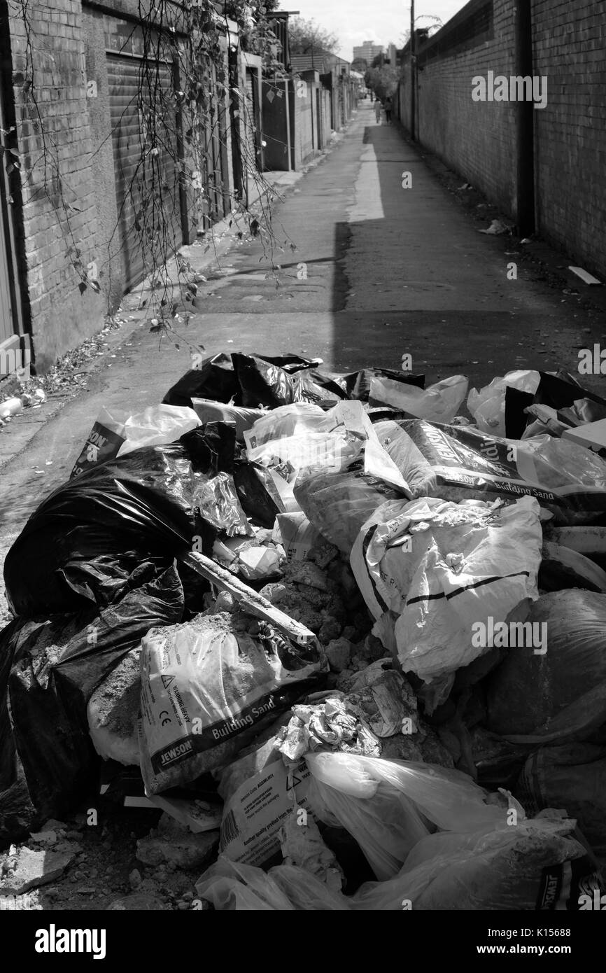 Back alley rubbish Black and White Stock Photos & Images - Alamy