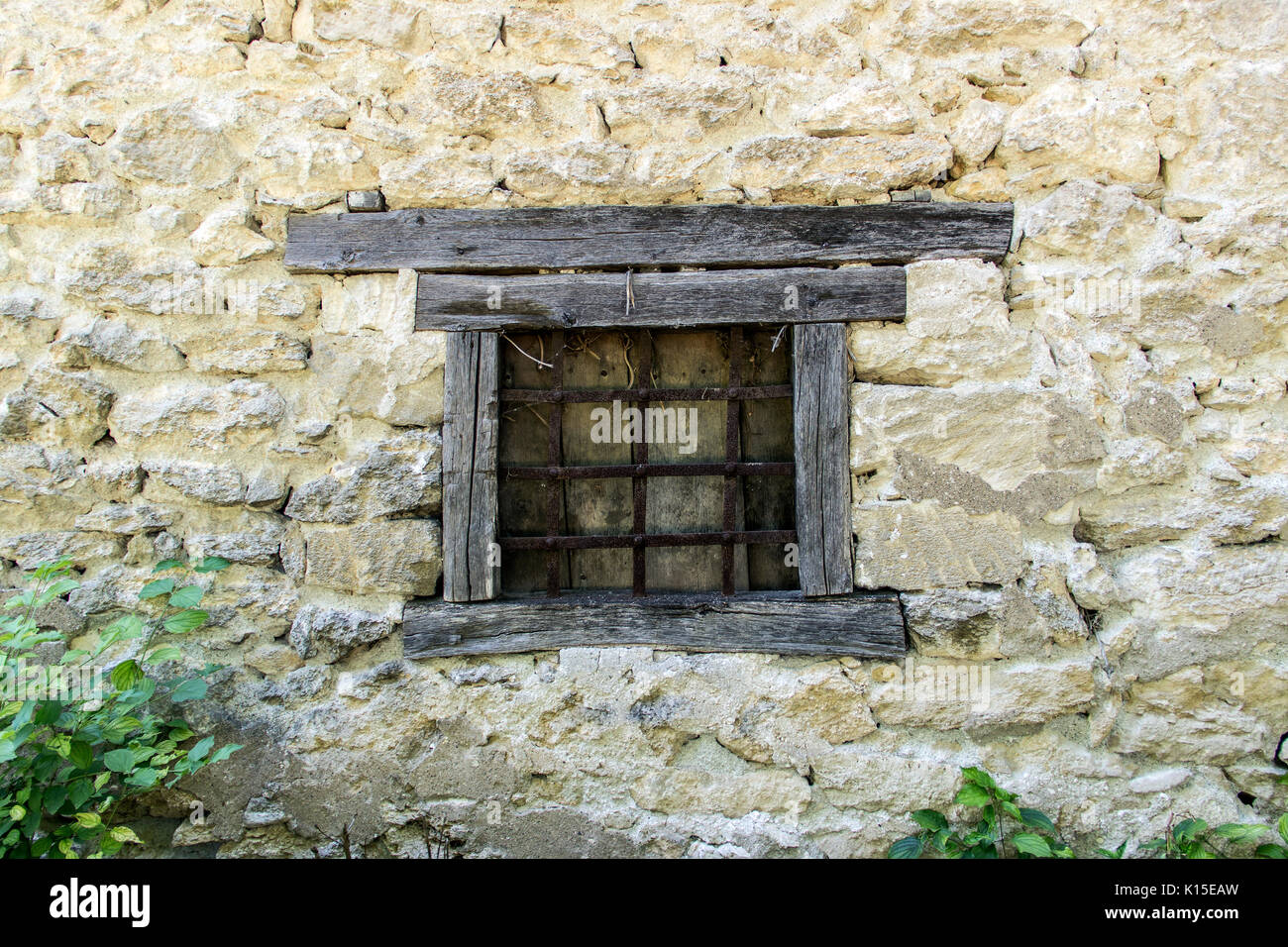 Countryside, East Serbia - A window with grids on the stone wall of an ...