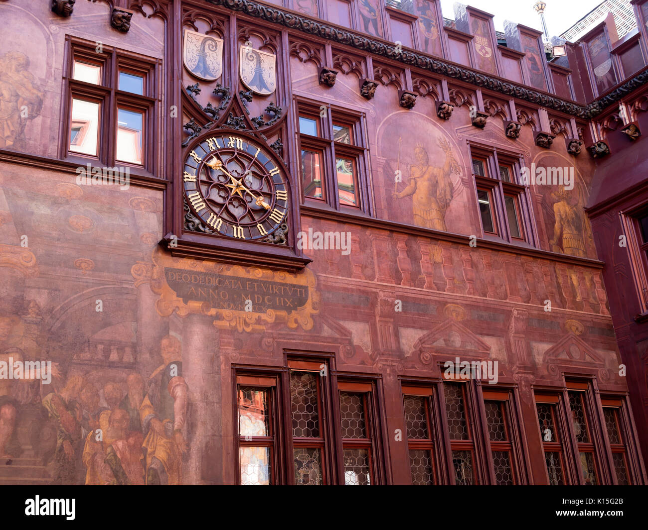 Clock and frescoes in the courtyard of Basel Town Hall Stock Photo - Alamy
