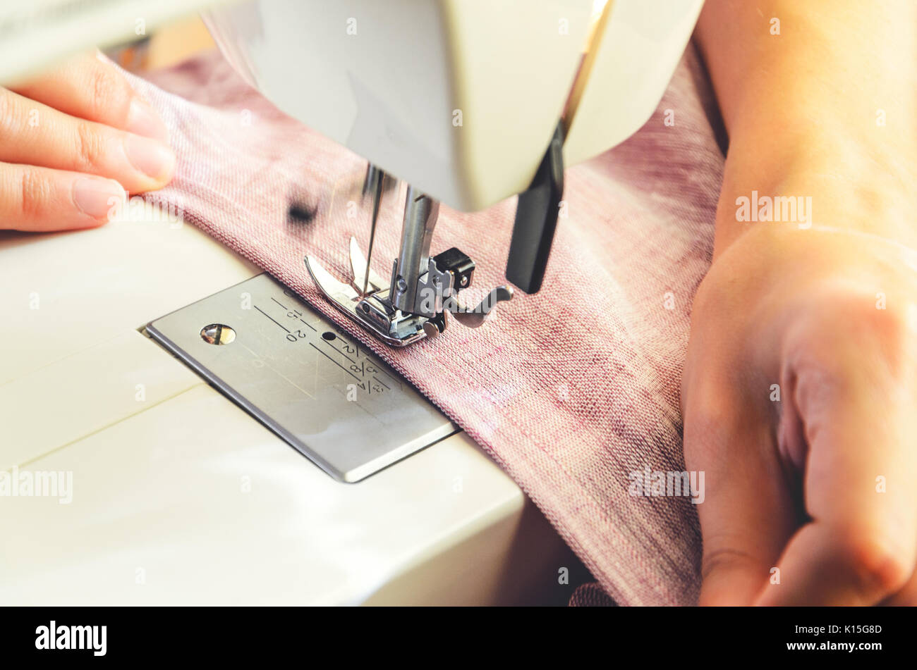 Sewing process on the sewing machine Stock Photo - Alamy