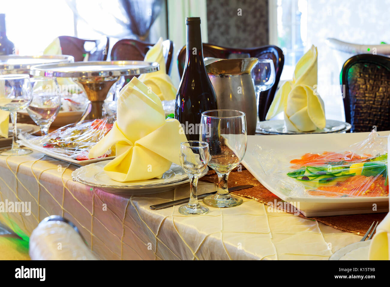catering table set service with silverware, napkin and glass at ...