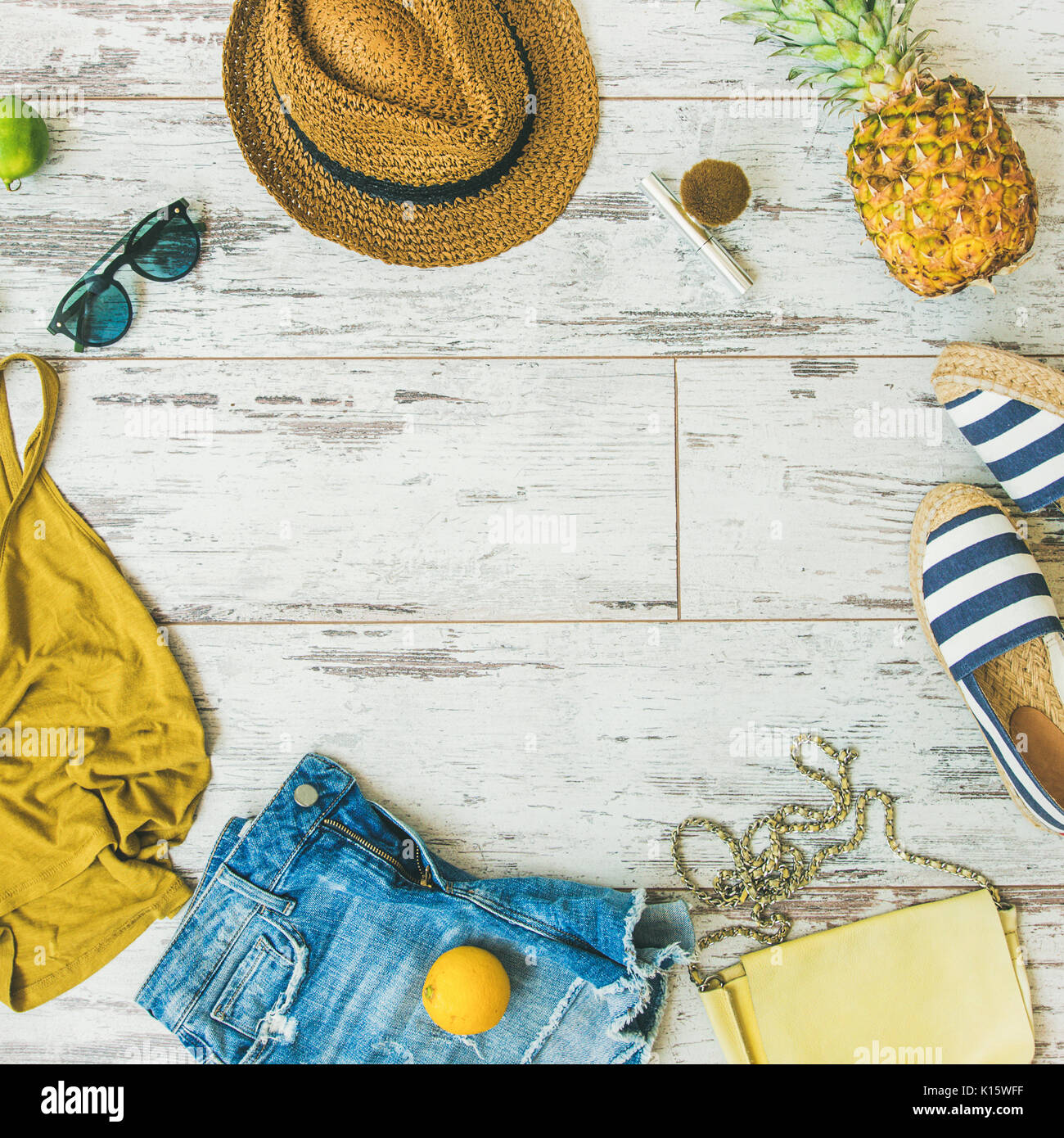 Colorful summer fashion outfit flat-lay over parquet background, square ...