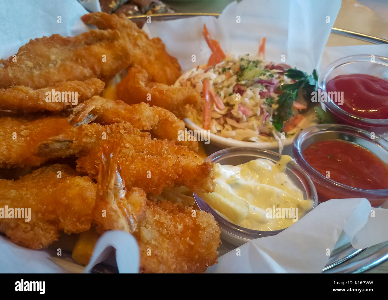 Fried Shrimp Basket with Coleslaw and Condiments Stock Photo - Alamy