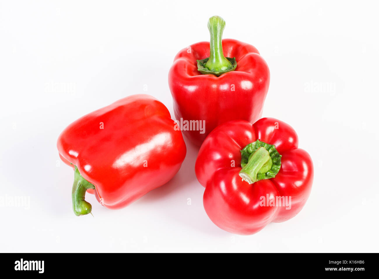 Red ripe peppers lying on white background, concept of healthy ...