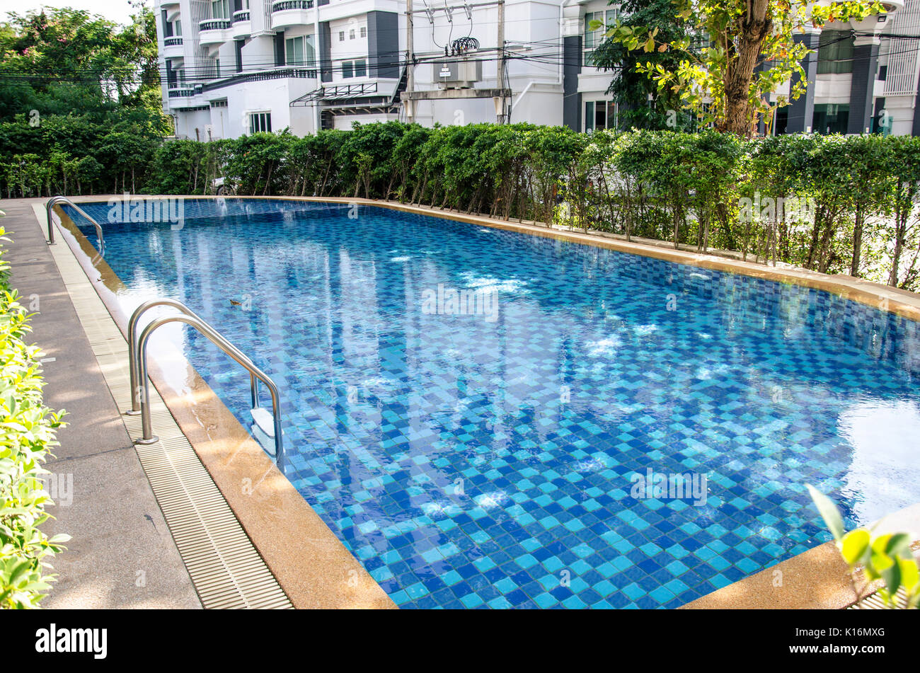 Swimming pool beautiful in tropical resort Stock Photo - Alamy
