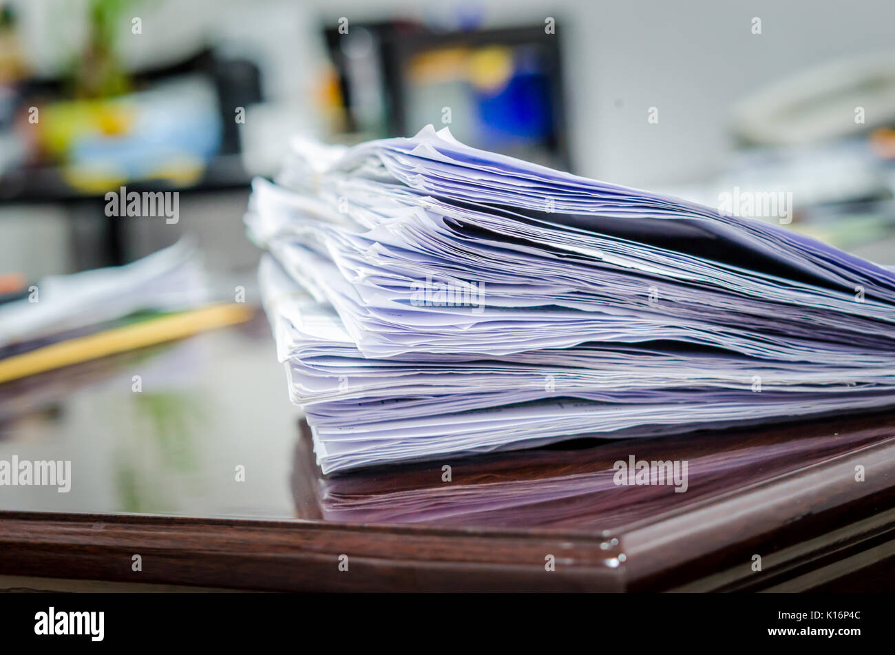 Pile of documents on desk Stock Photo - Alamy