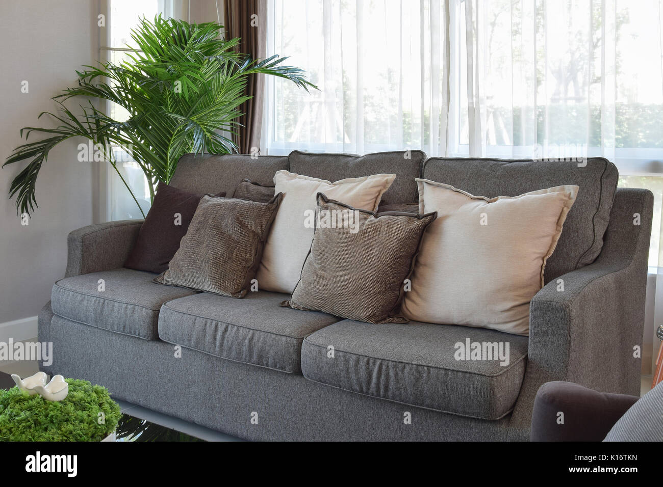 modern living room design with sofa and wooden lamp Stock Photo - Alamy