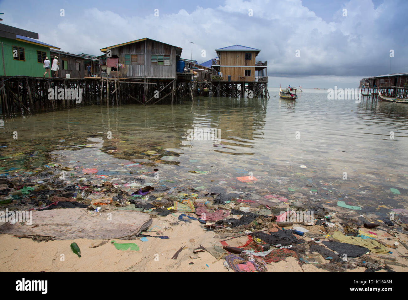 Plastic trash and other garbage make for an ugly beach scene on Mabul ...