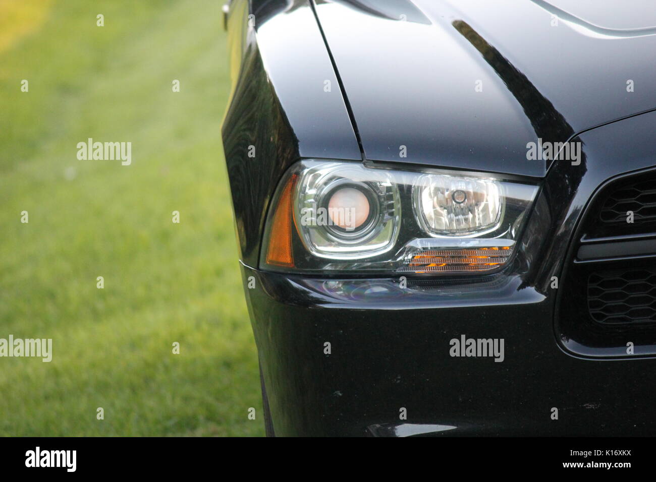 Mean car shows its headlights Stock Photo - Alamy