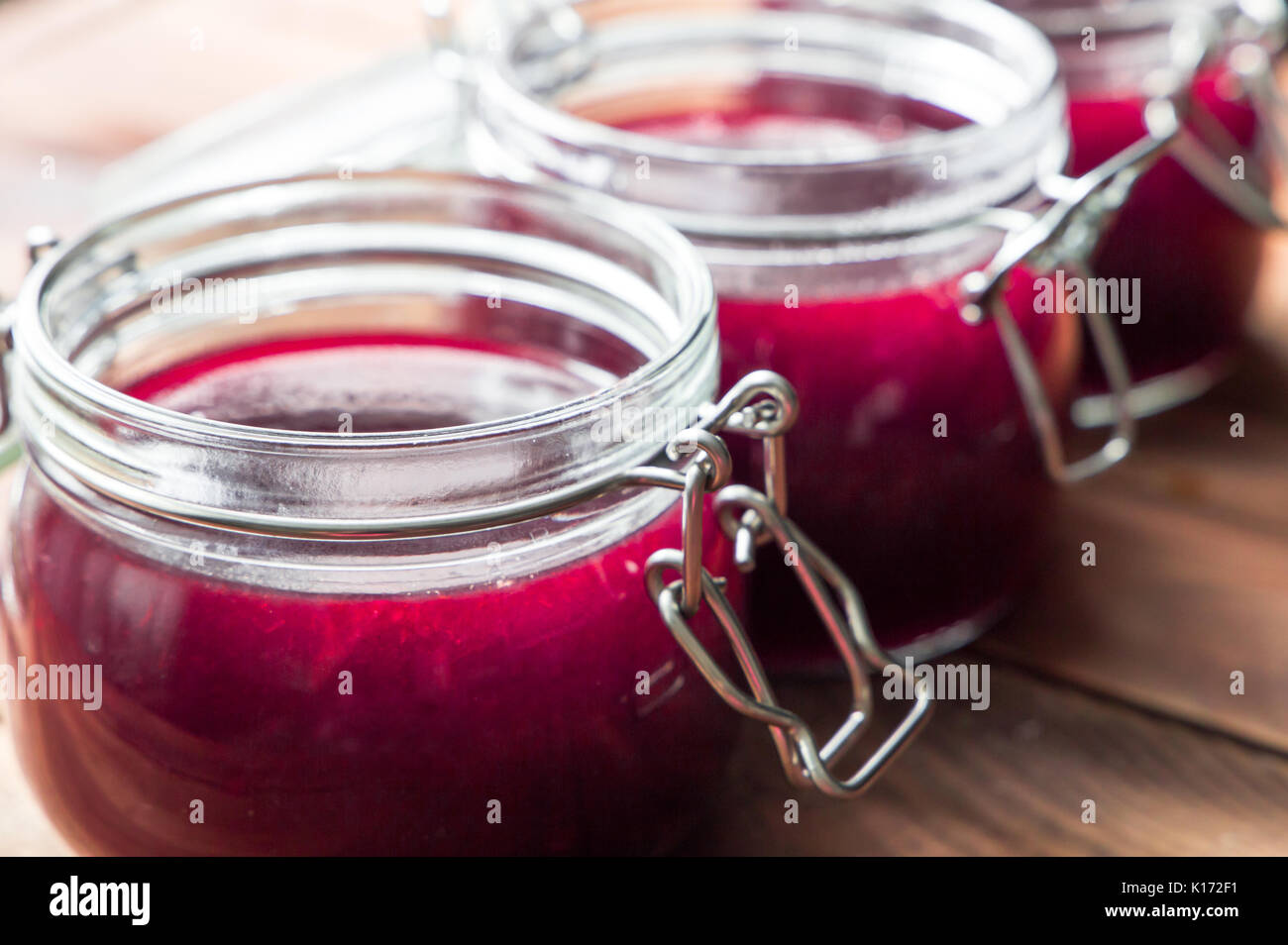 Close Up View Of Jars With Sweet Tasty Yummy Red Jam Stock Photo - Alamy