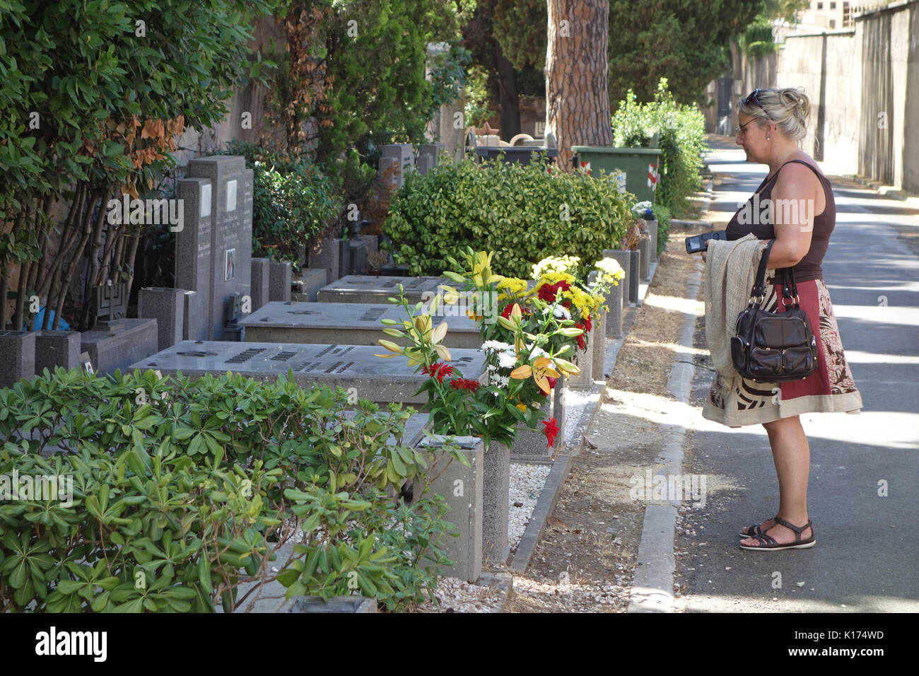 Visit to the cemetery hi-res stock photography and images - Alamy