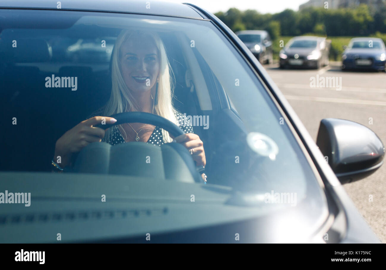 Photo of blonde driving car Stock Photo - Alamy