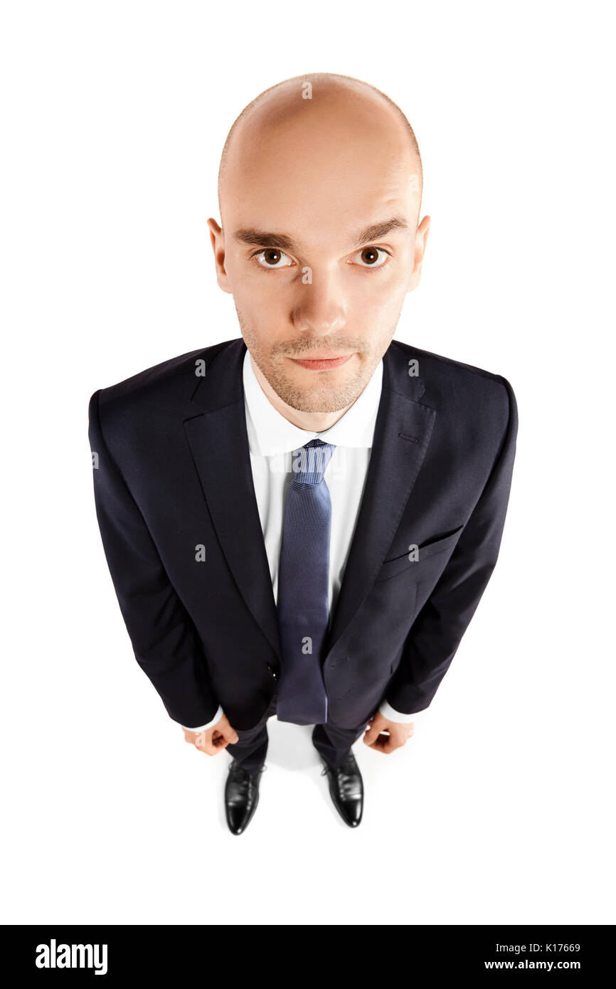 Overhead view of a young man looking up. Studio shot isolated on white ...
