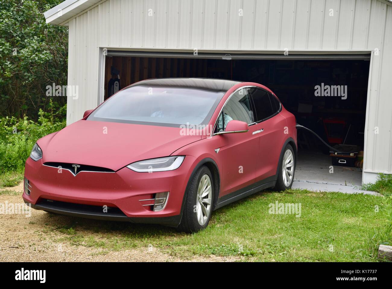 Tesla Model X cross-over, all-electric vehicle recharging at ...
