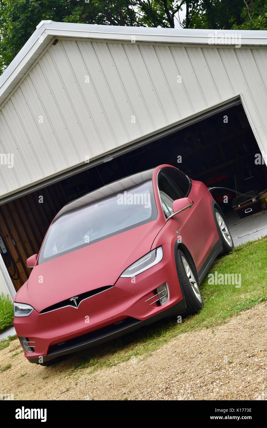 Tesla Model X cross-over, all-electric vehicle recharging at ...