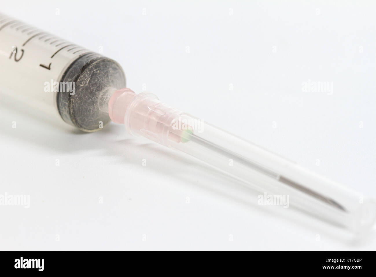 Syringe close up isolated on white background Stock Photo - Alamy