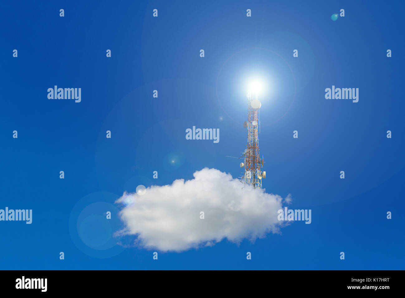 Mobile phone communication antenna tower with the blue sky and clouds ...