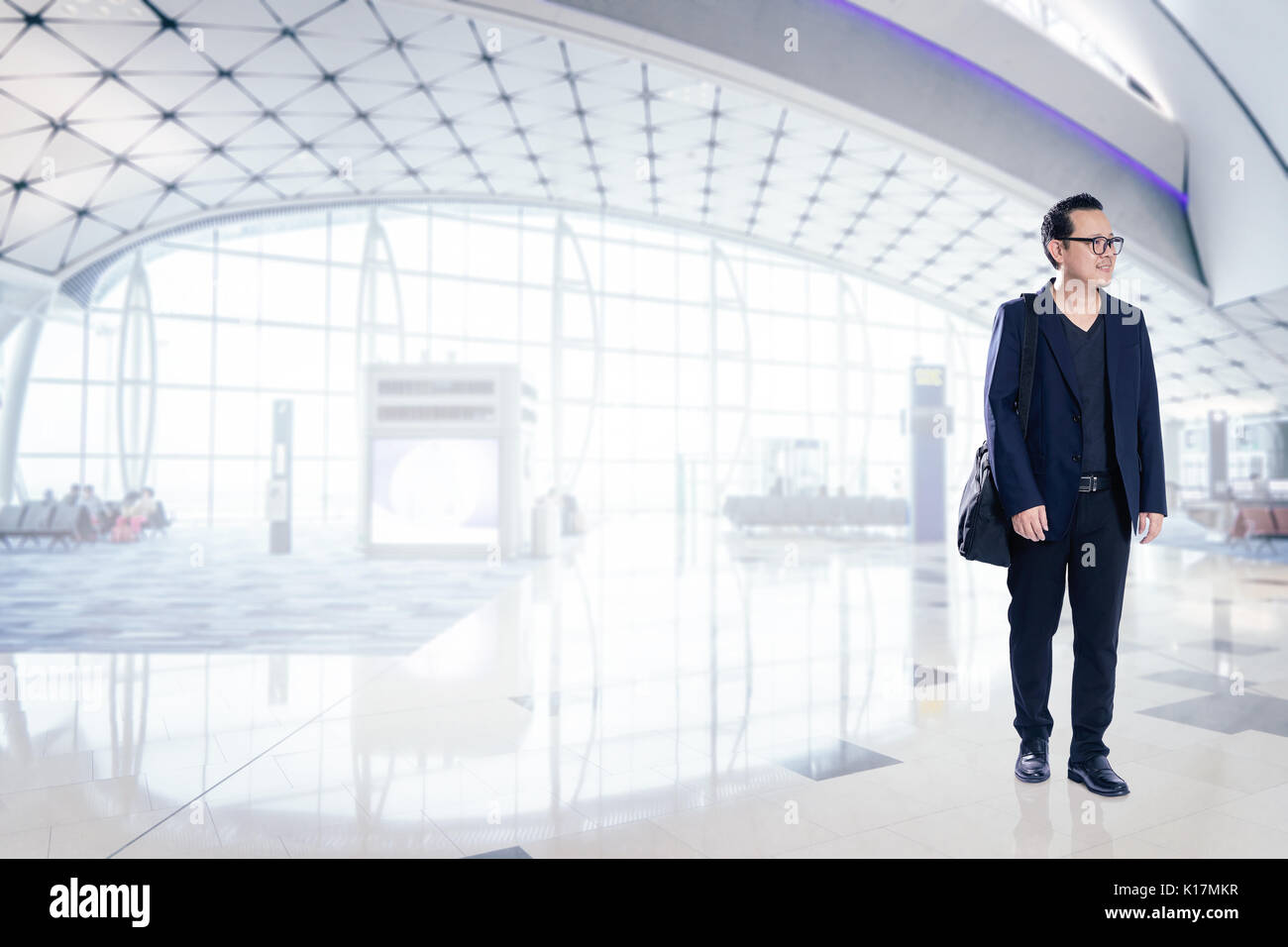 Young business man smiling happy inside airport waiting hall Stock ...