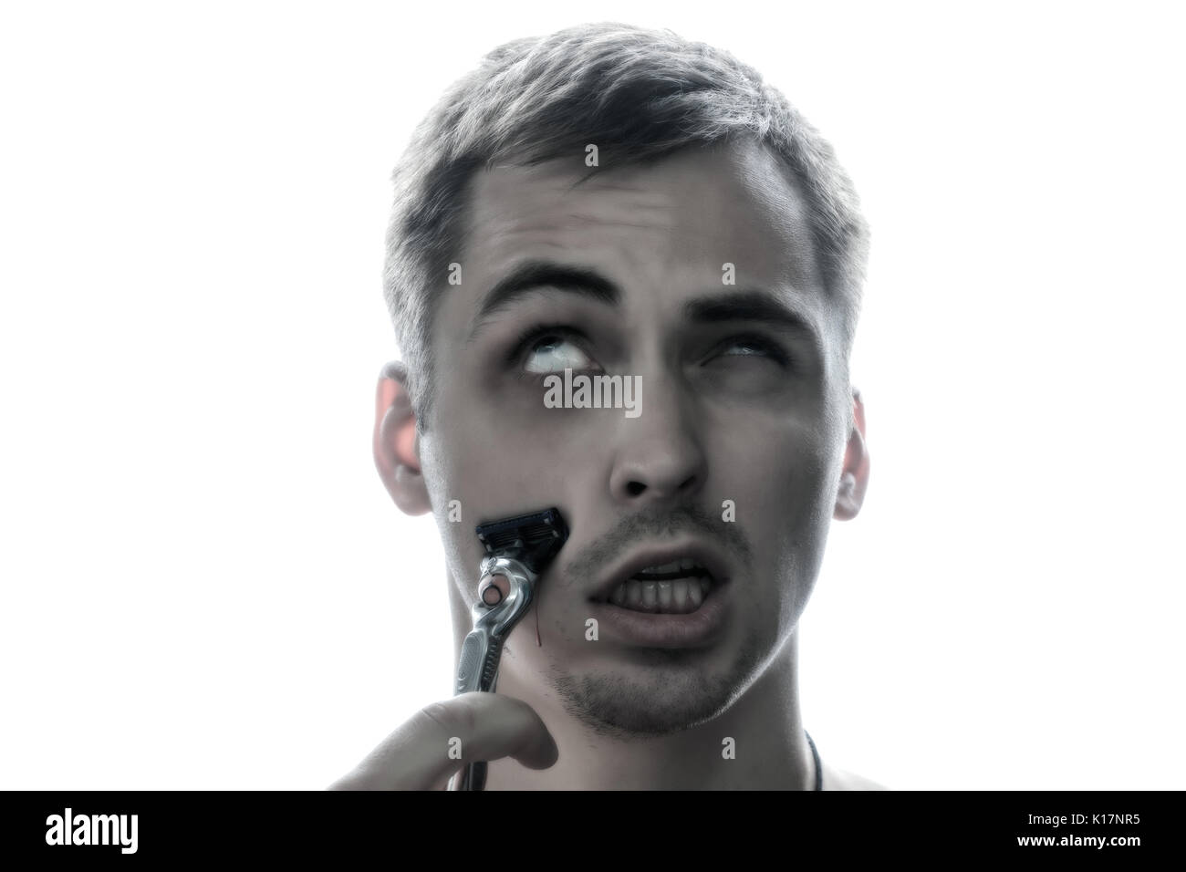 Guy cut cheek razor hi-res stock photography and images - Alamy