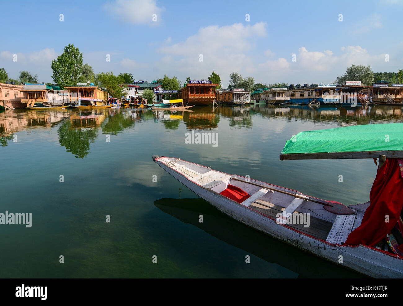 Srinagar, India - Jul 24, 2015. A wooden boat with floating houses on ...