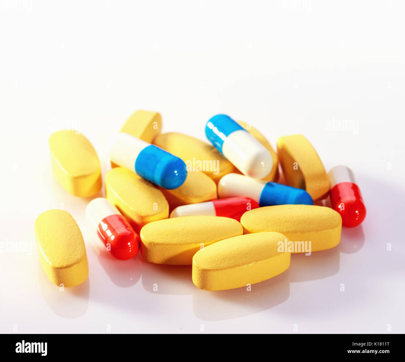 Prescription drugs, pills, capsules and tablets of different colors all ...
