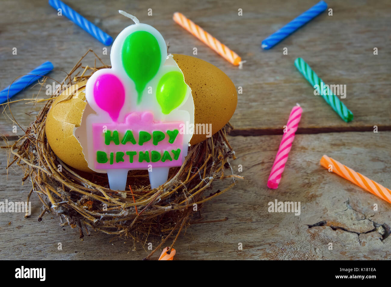 Shattered Eggshell With Nest and Candle for Happy Birthday Concept ...