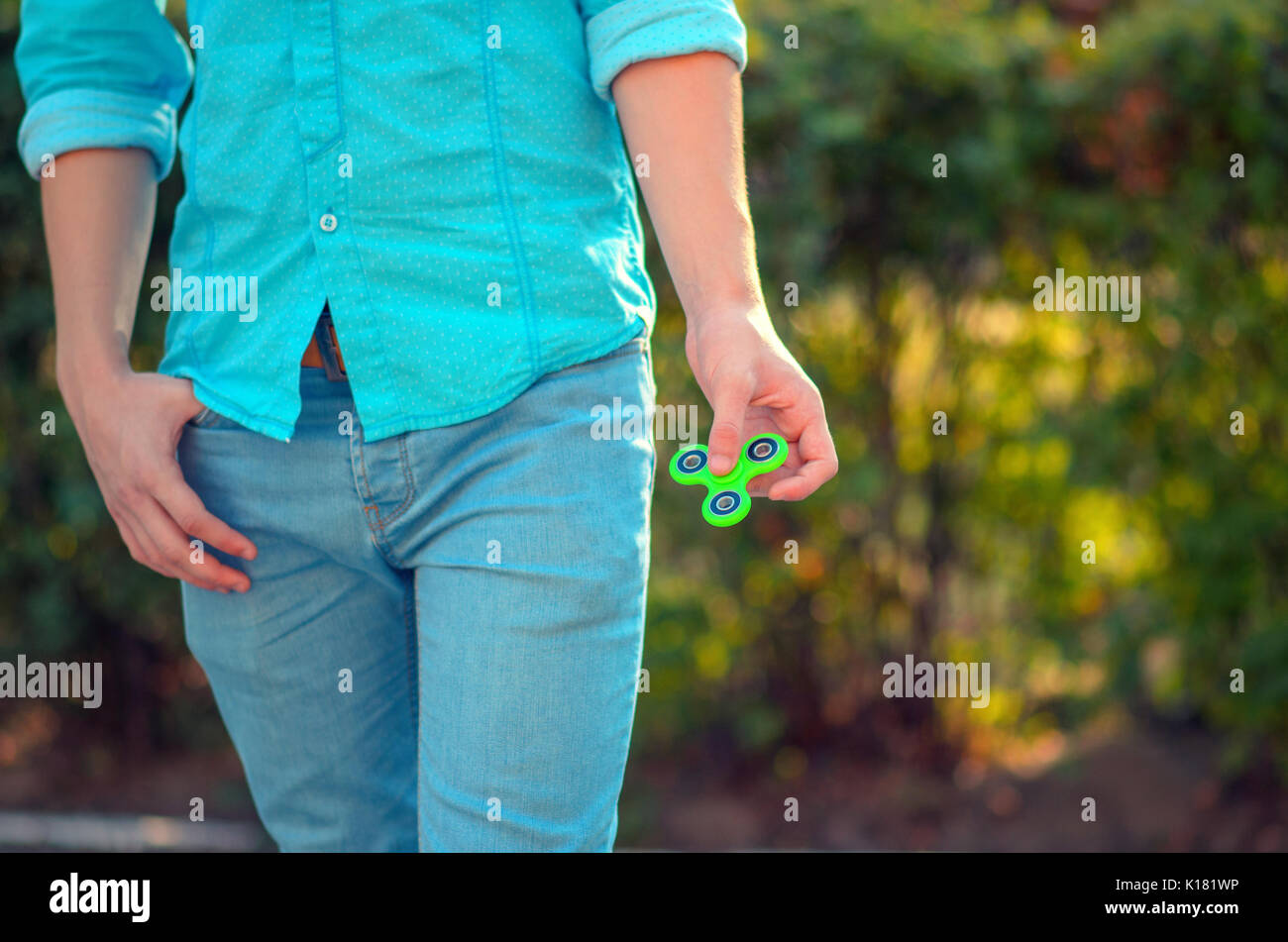 Playing with fidget spinner hi-res stock photography and images - Alamy