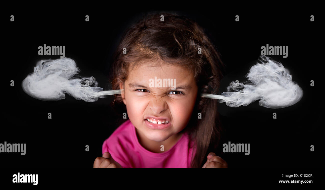 Angry four years girl with smoke through the ears Stock Photo - Alamy
