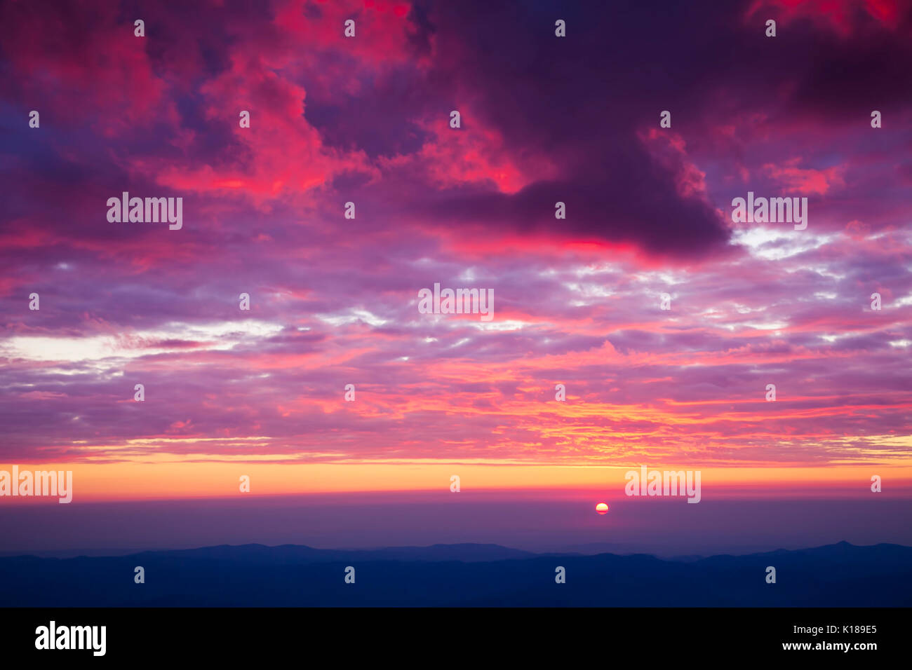 pink sunset or sunrise with beautiful clouds on the sky Stock Photo - Alamy