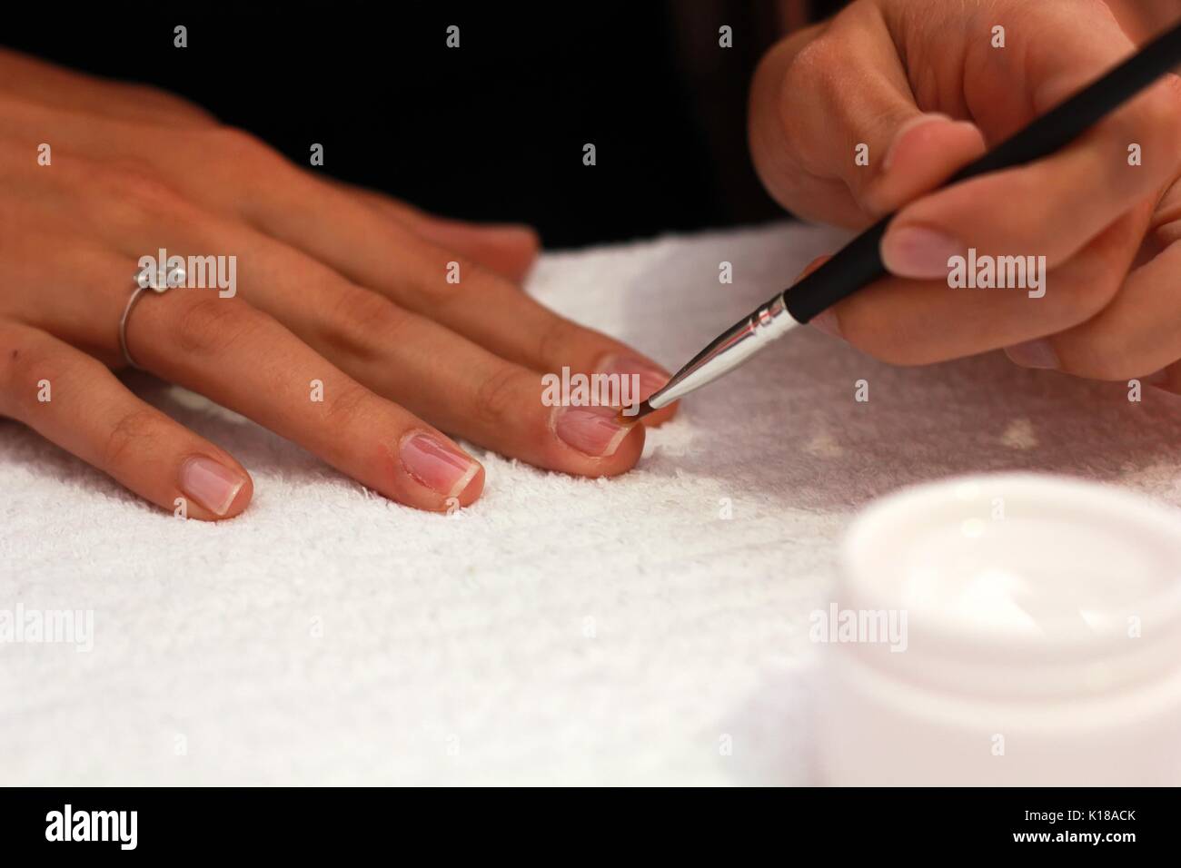 Woman work on nails Stock Photo - Alamy