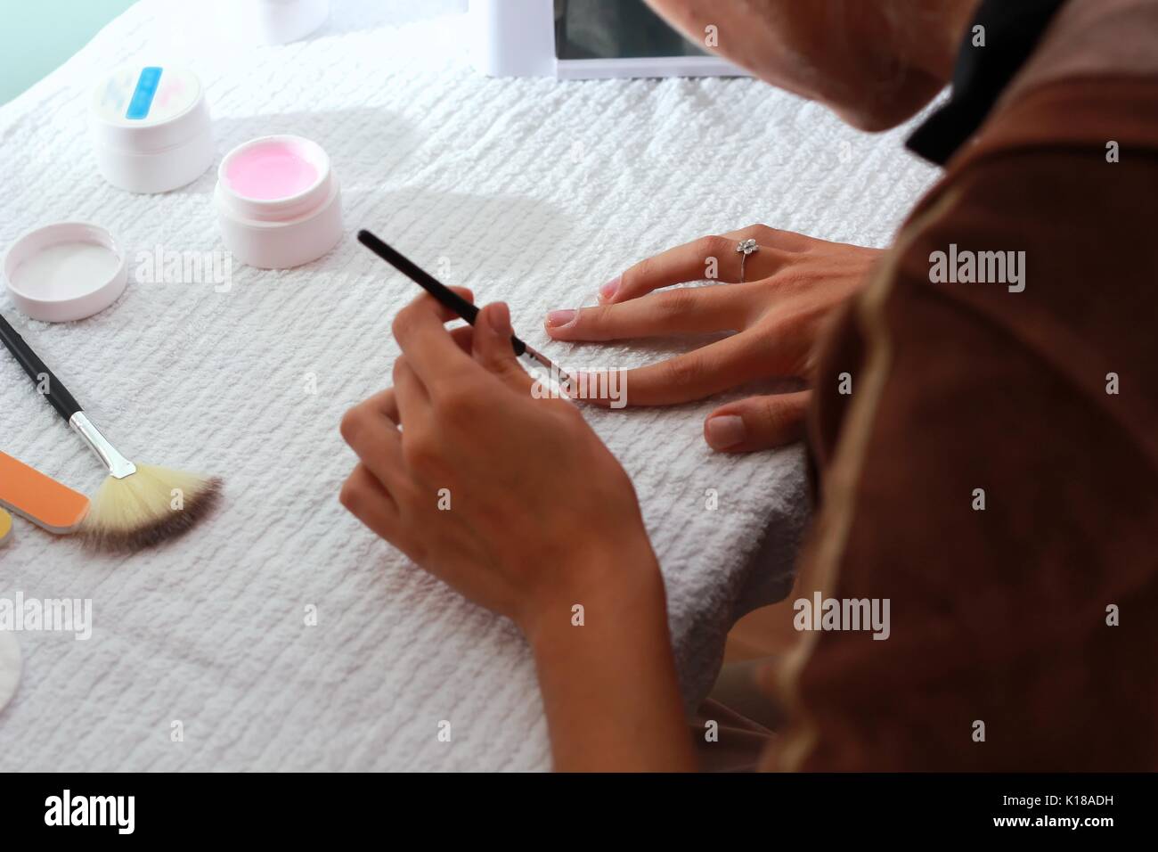 Woman work on nails Stock Photo - Alamy