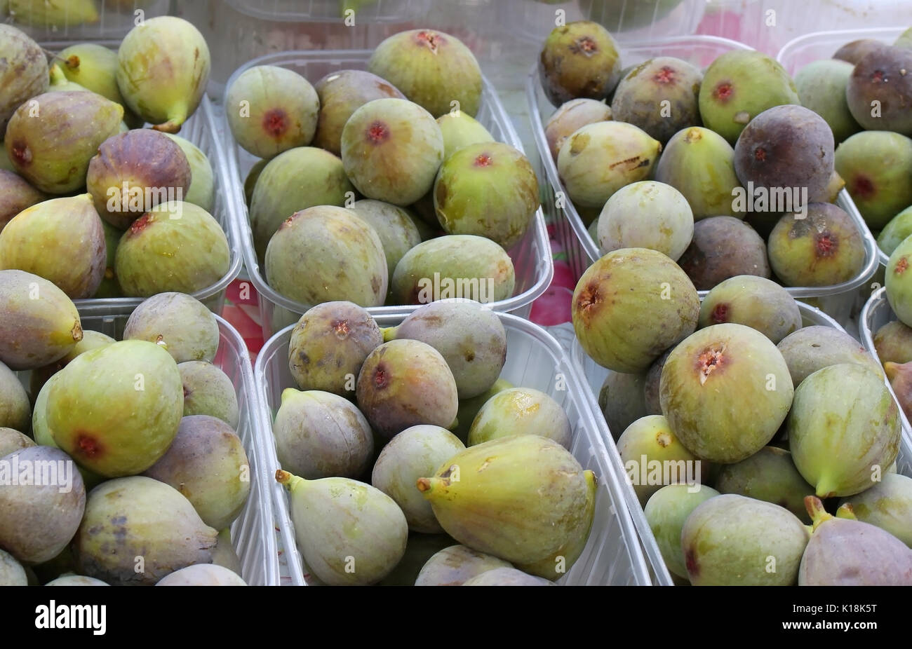 Fresh organic figs piles in plastic containers Stock Photo - Alamy