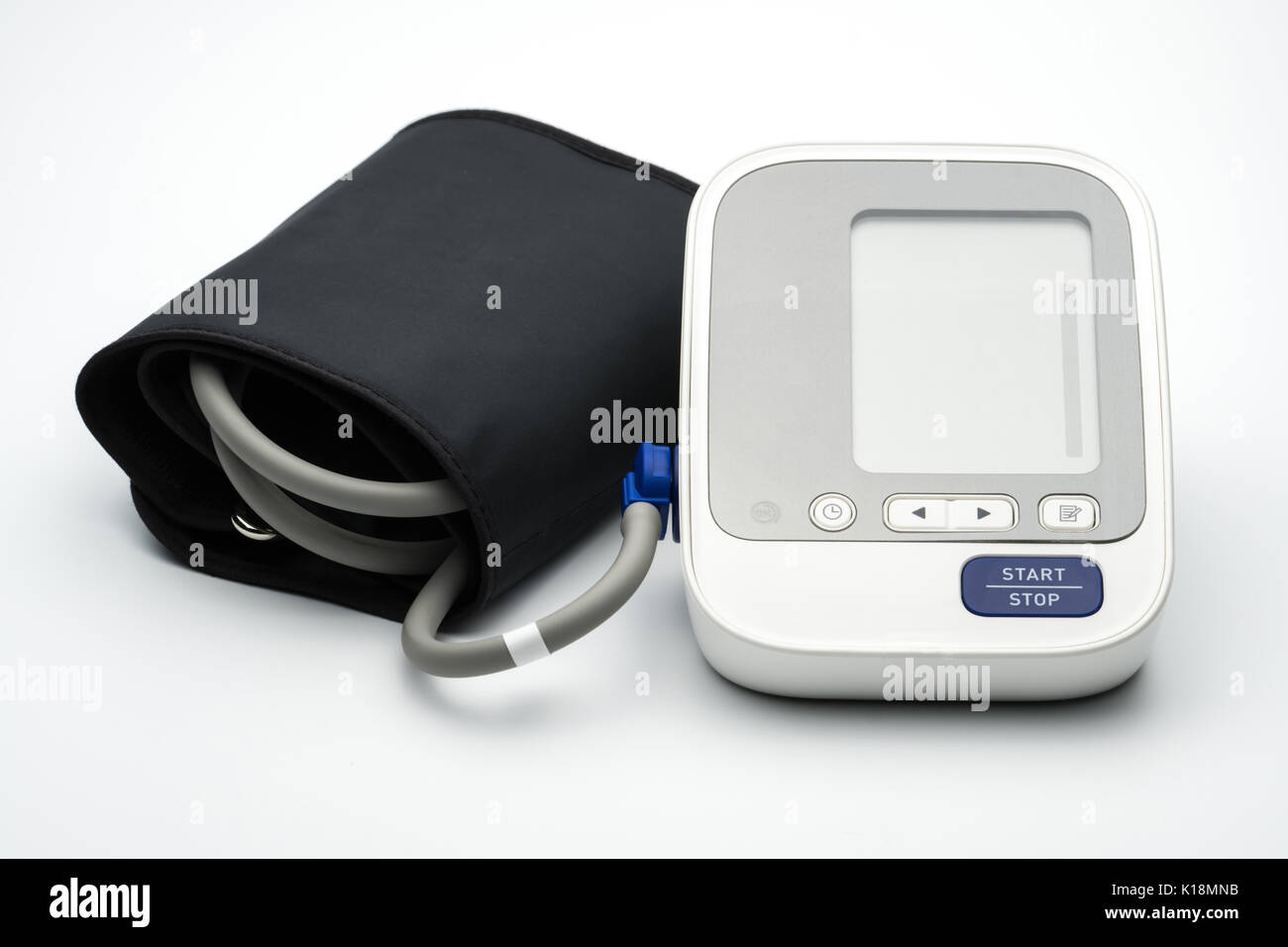 Automatic blood pressure monitor with wide range cuff on white ...