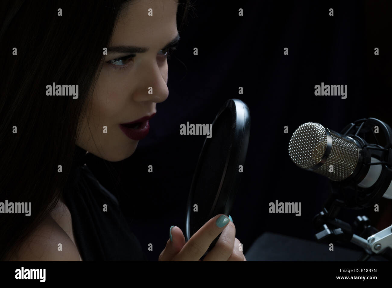 Beautiful girl singing In Recording Studio with microphone Stock Photo ...