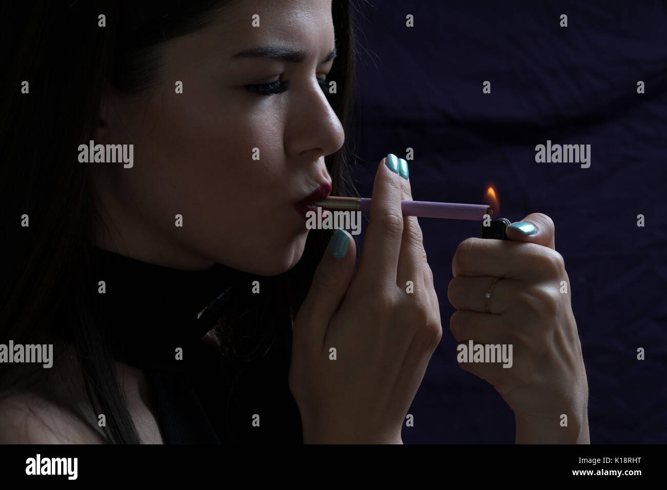 Portrait of the beautiful elegant girl smoking cigarette isolated on ...