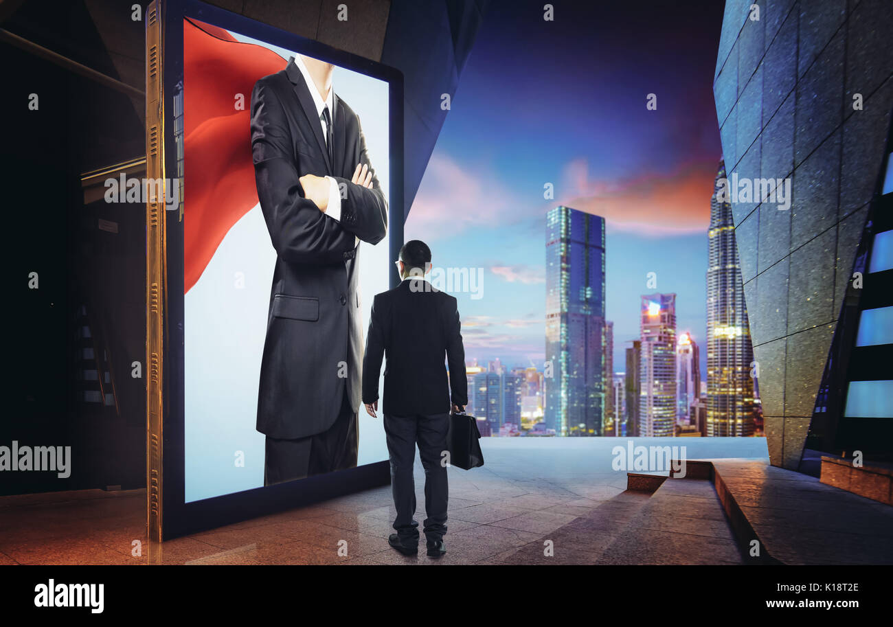 Young businessman looking the hero businessman on the advertising ...