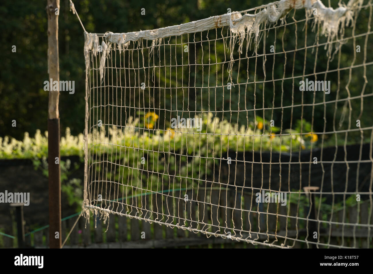 An old volleyball net on a country plot Stock Photo - Alamy