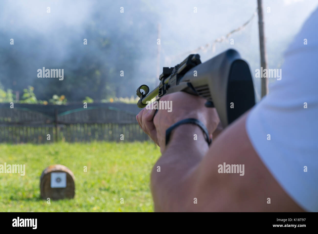 Man shooting rifle behind hi-res stock photography and images - Alamy