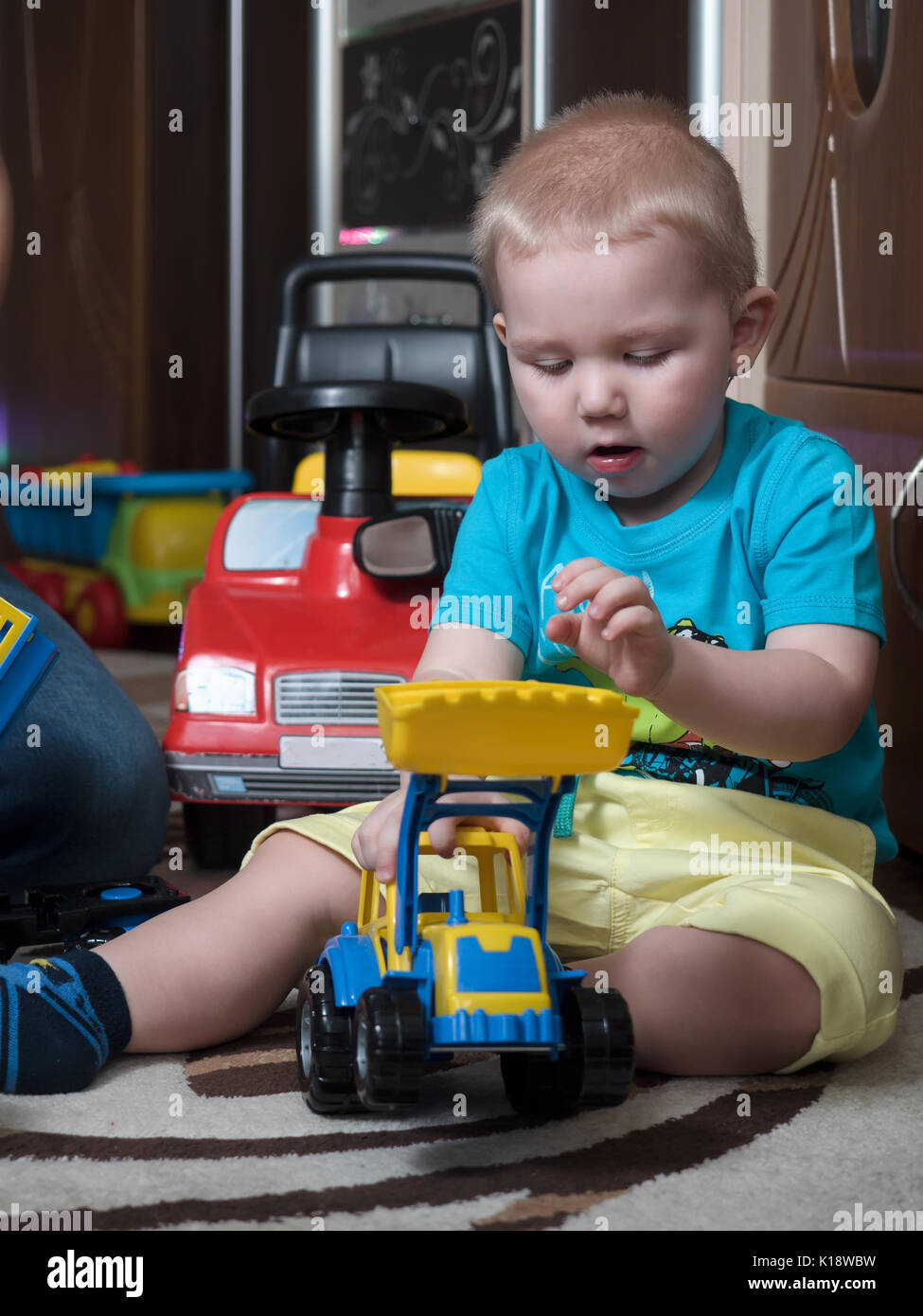 child boy and his father play with a toys together Stock Photo - Alamy
