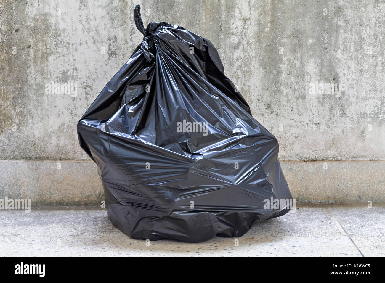 close-up of a full garbage bag on floor Stock Photo - Alamy