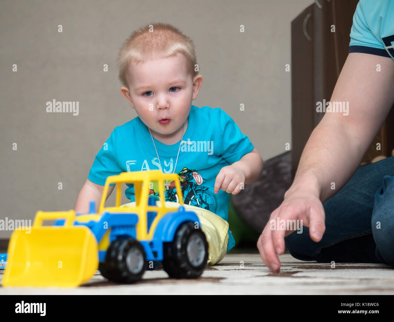 child boy and his father play with a toys together Stock Photo - Alamy