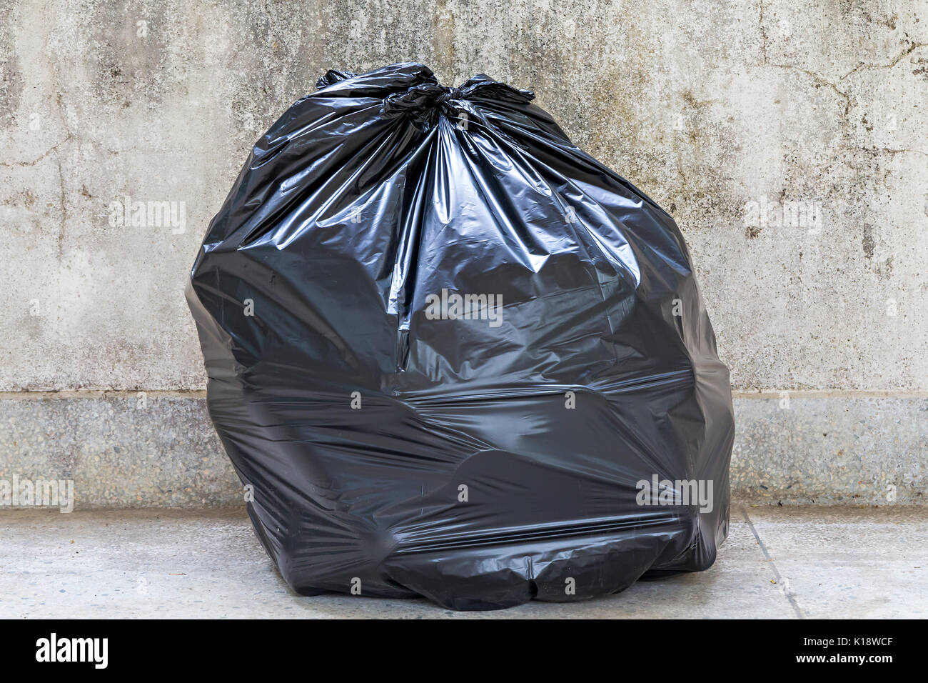 Black plastic bag on the floor hi-res stock photography and images - Alamy