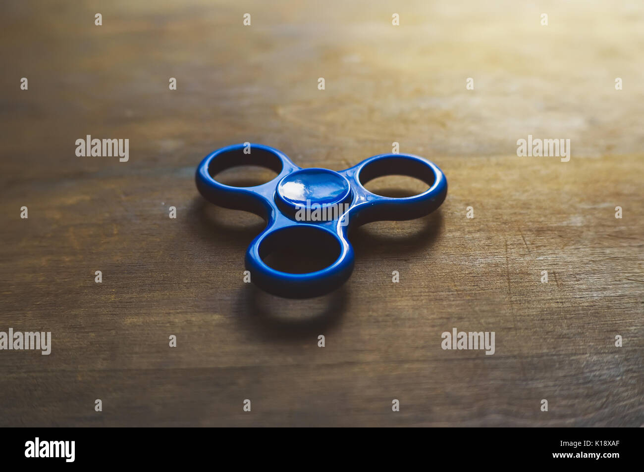 Blue spinner wooden table background. Powerful spinner, spinner ...