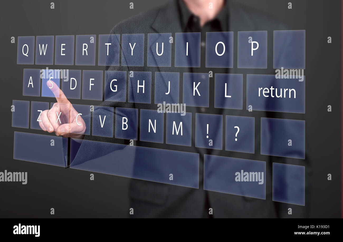 Man in black shirt and suit pointing his finger on virtual qwerty ...
