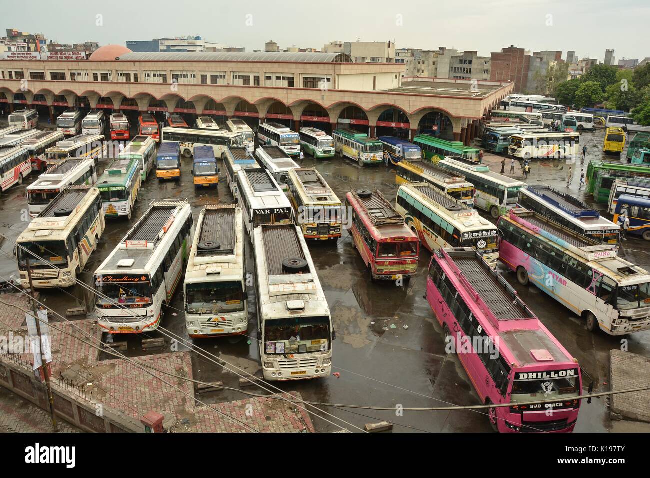 AMRITSAR, INDIA - AUGUST 25: Buses stand parked at a bus stand in ...
