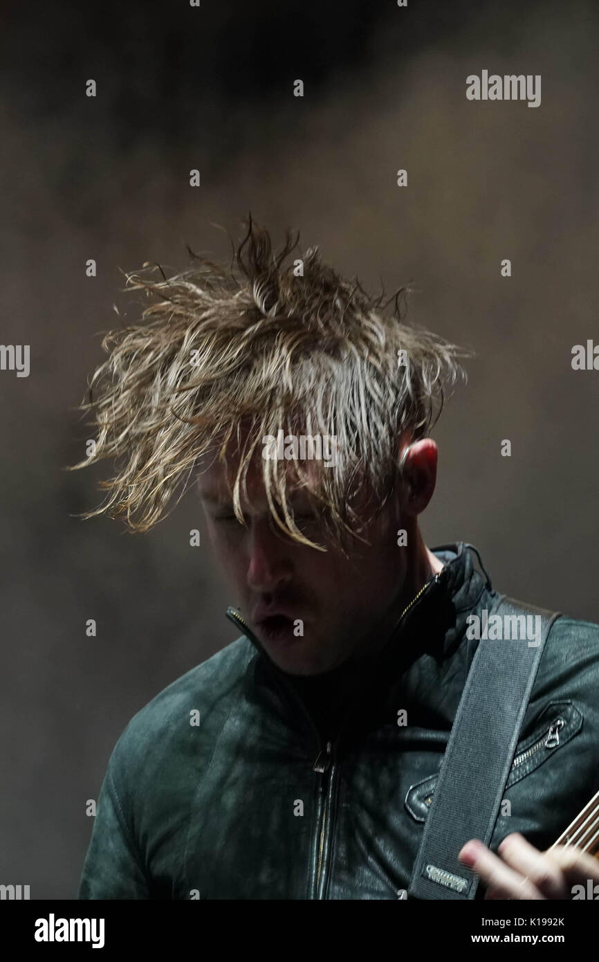 Michael Shuman of Queens of the Stone Age performing a surprise gig in ...