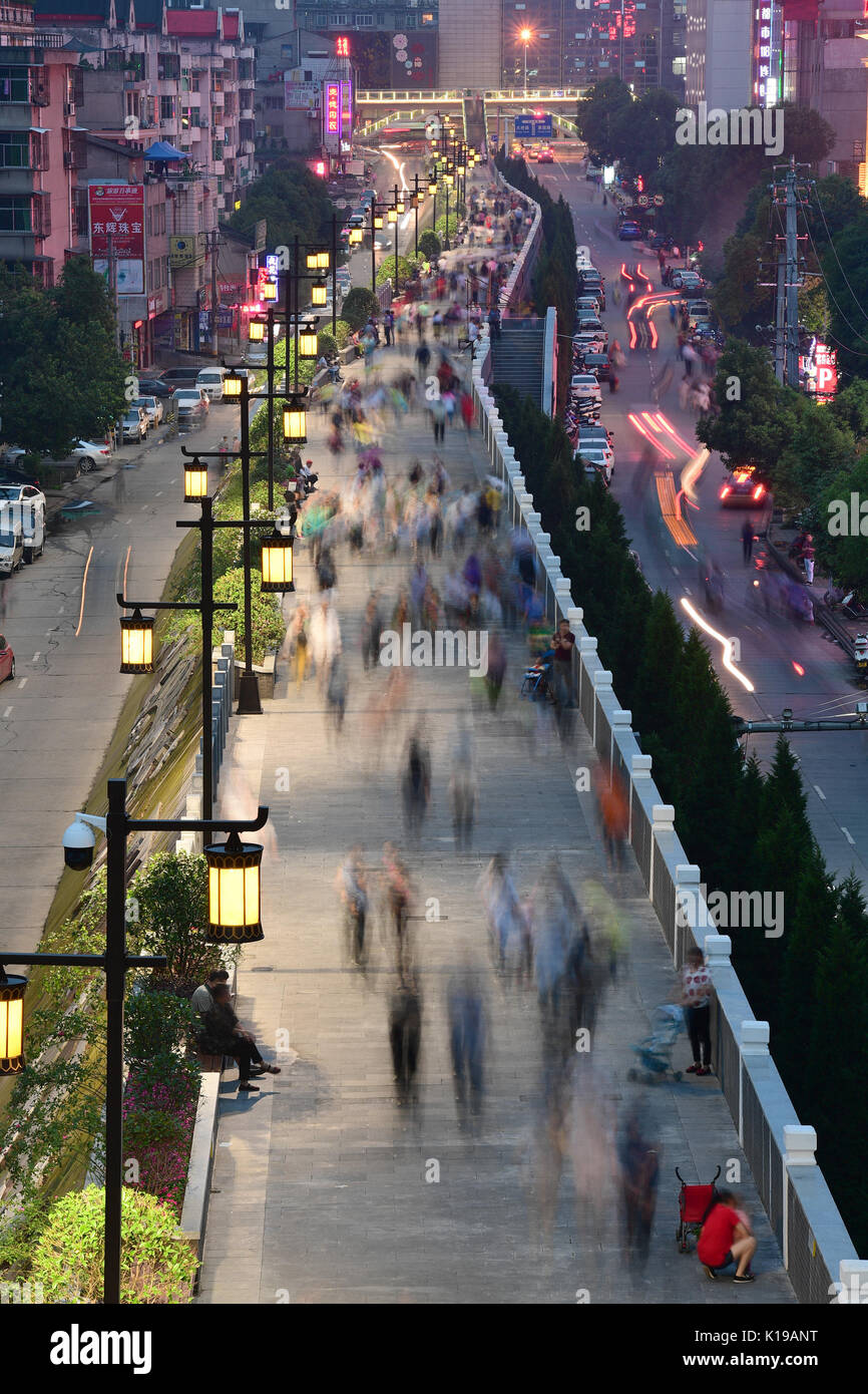 Ankang, China's Shaanxi Province. 14th June, 2017. People walk on a ...