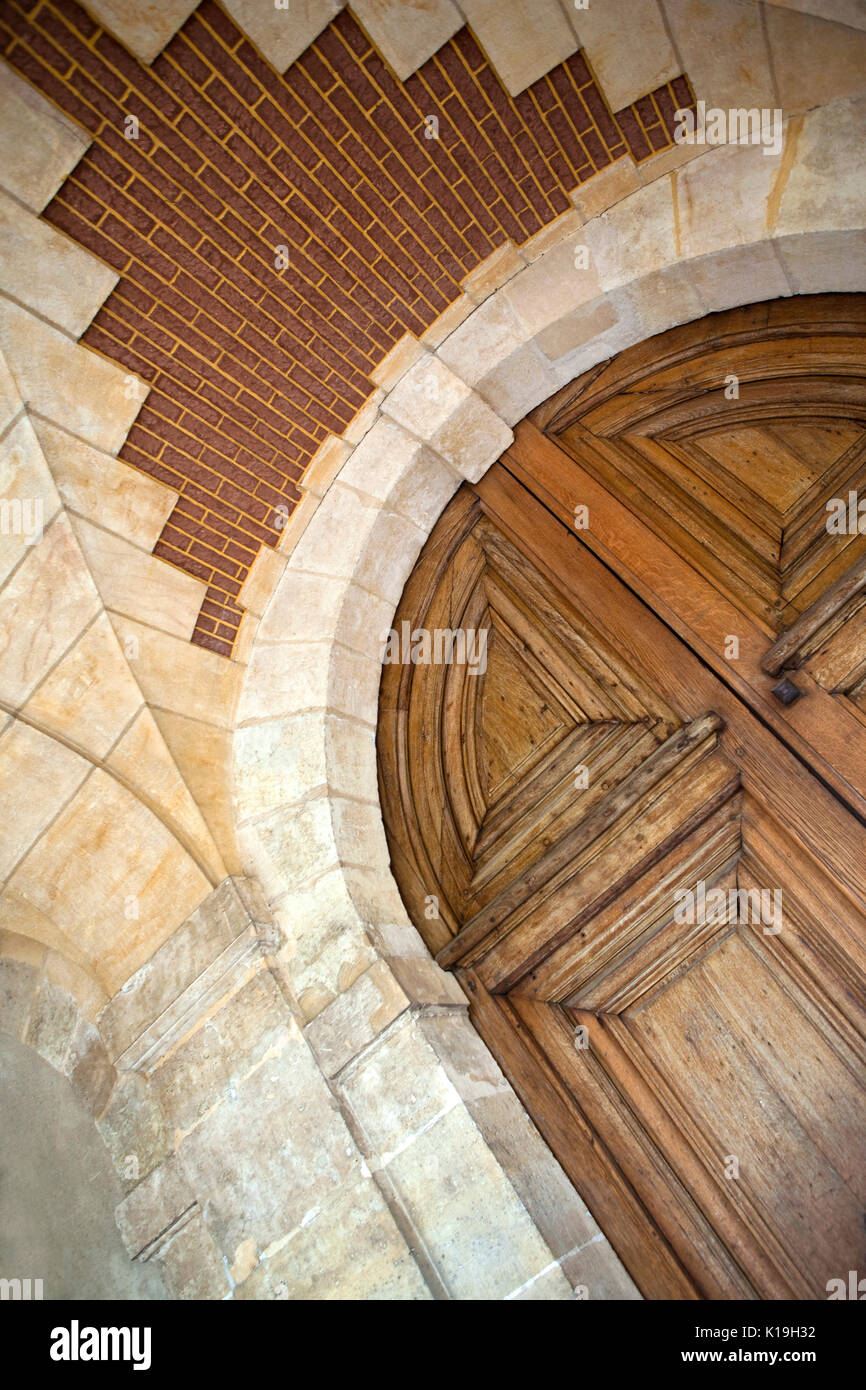 Old wooden mansion door in Paris place Stock Photo - Alamy